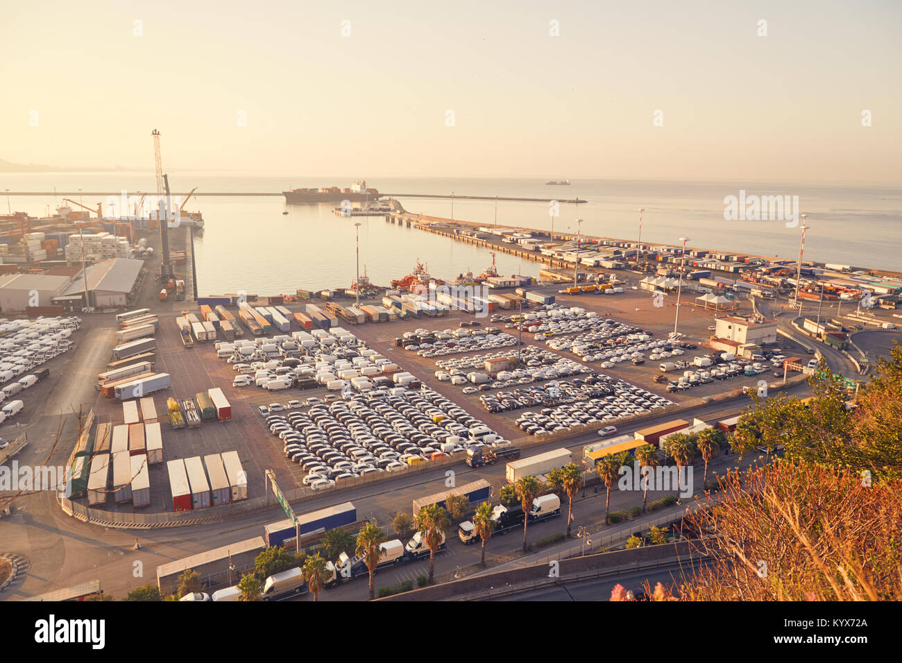 Cargo port terminal with a large number of containers and new cars. In ...