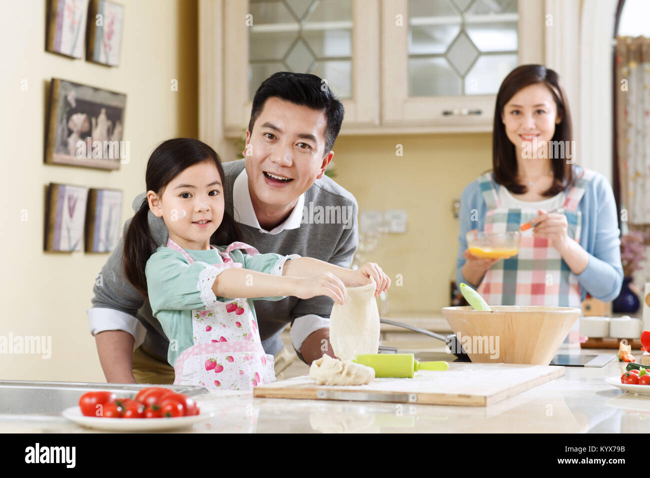 Indian couple in apron fun kitchen hi-res stock photography and images ...