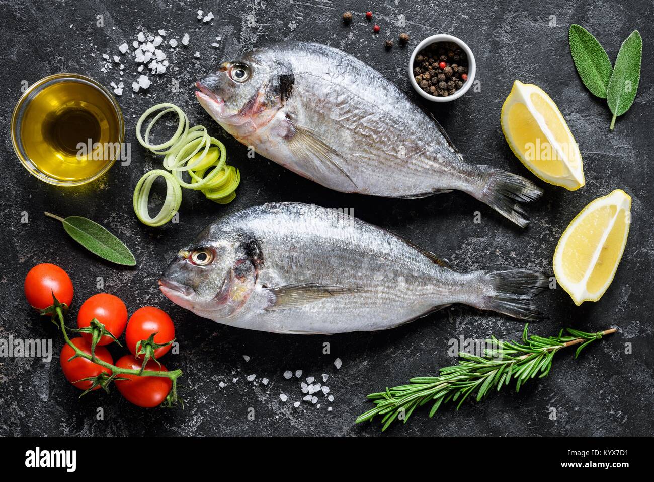 Sea bream or dorado sea fish, olive oil, spices herbs and cooking ...