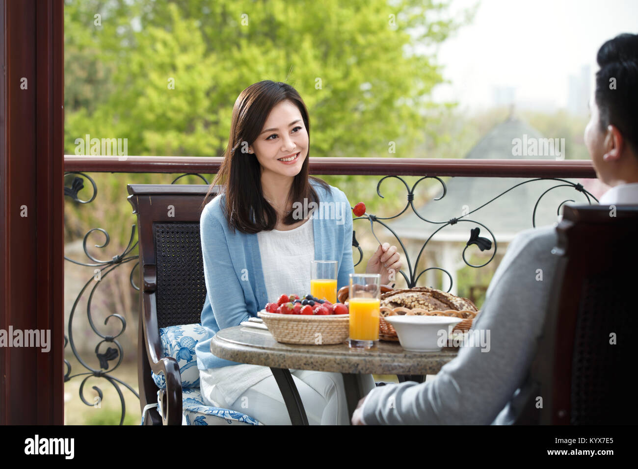 The middle-aged couple have their breakfast on the terrace Stock Photo ...