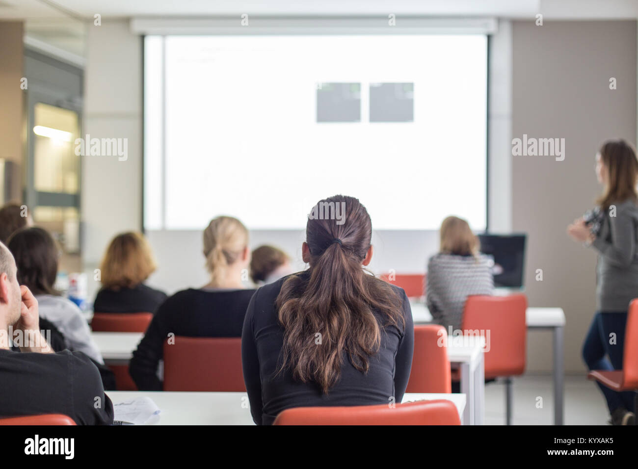 Woman giving presentation on business conference Stock Photo - Alamy