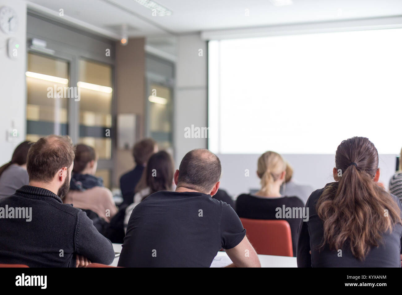Audience in the lecture hall listening to academic presentation Stock ...