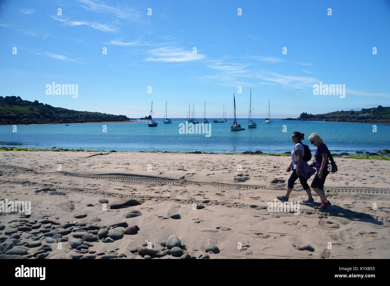 Two Women Walking Across (The Bar) a Sand & Shingle Beach that Links ...