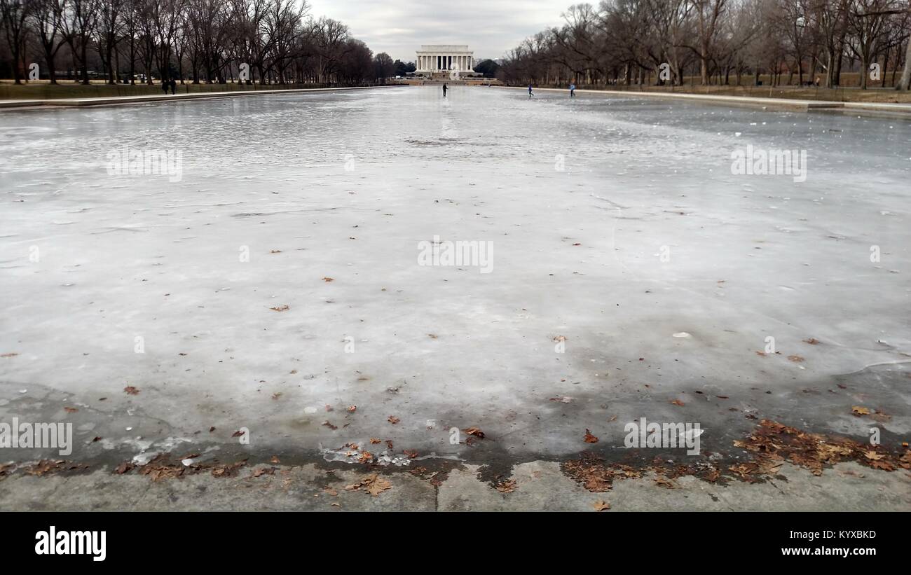 Solid ice seems to fill the frozen reflecting pool of Lincoln Memorial ...