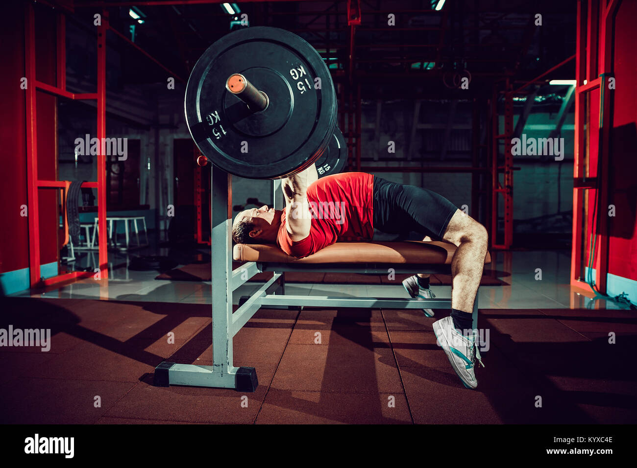 Man doing bench press workout in gym Stock Photo - Alamy