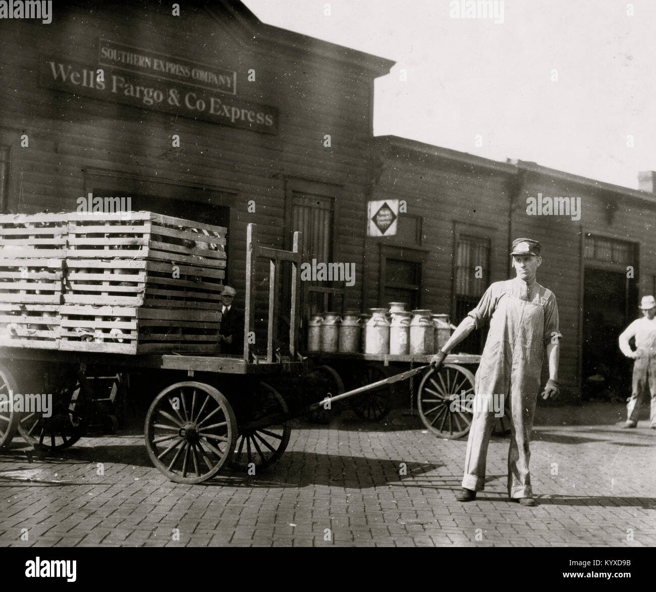 Expressman hauls cart of Crates at Wells Fargo Depot Stock Photo - Alamy