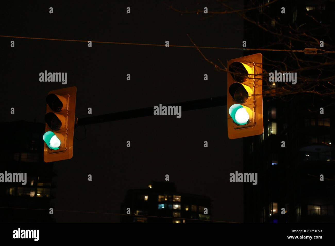 Two green lights night sky city Stock Photo - Alamy