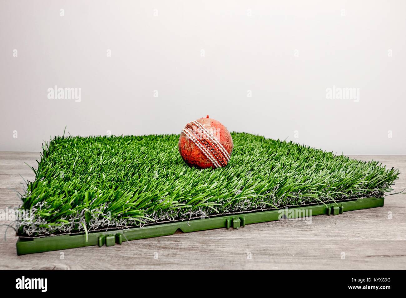 A studio photo of artificial grass with a blue background Stock Photo ...