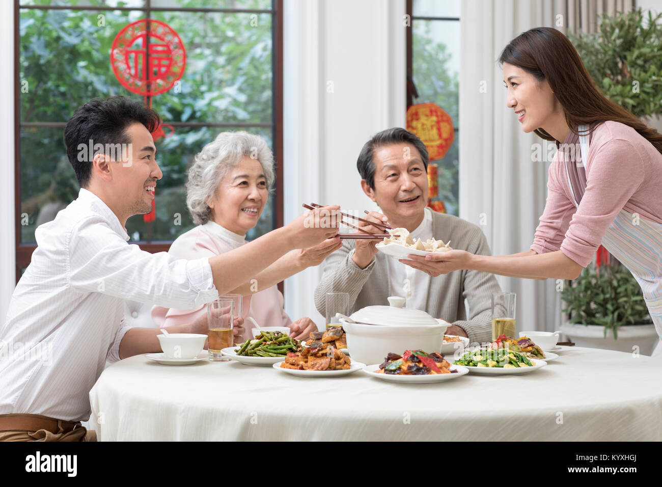 Chinese family having dinner hi-res stock photography and images - Alamy
