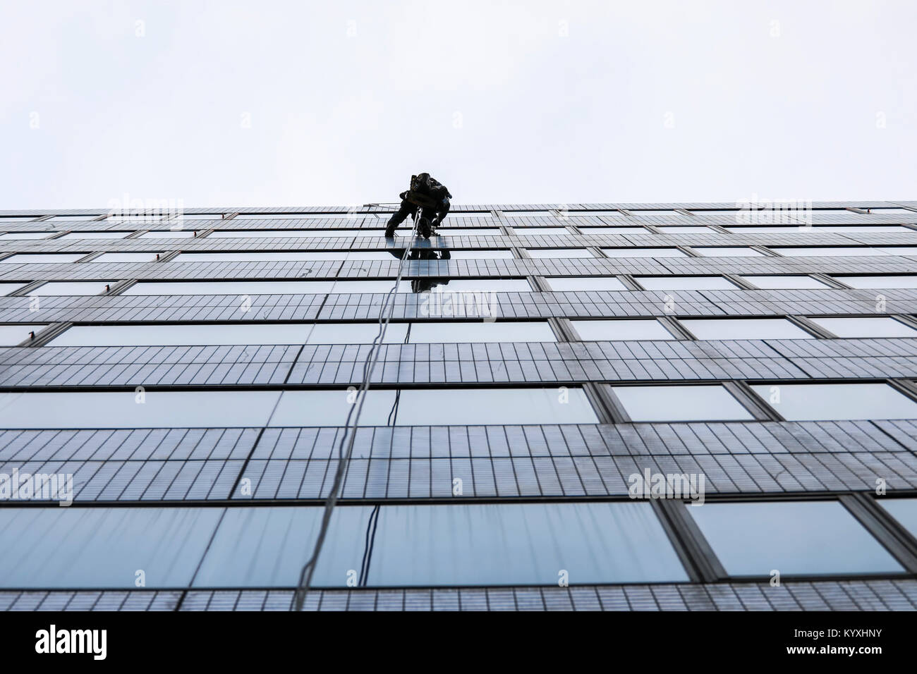 clean the building window,worker cleaning high tower Stock Photo - Alamy