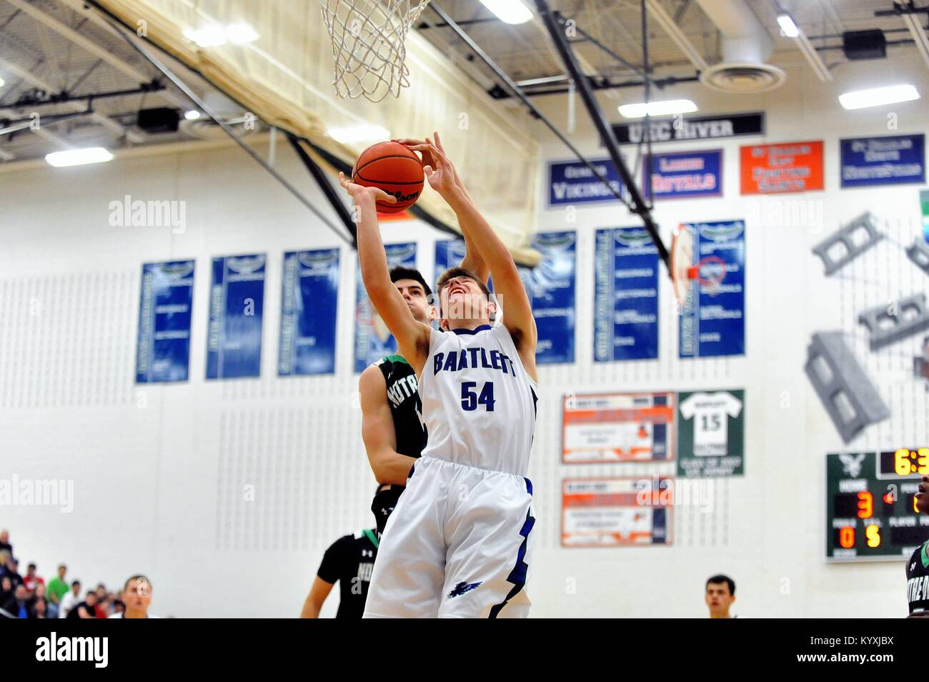 Player having a shot blocked from behind by an opponent during a high ...
