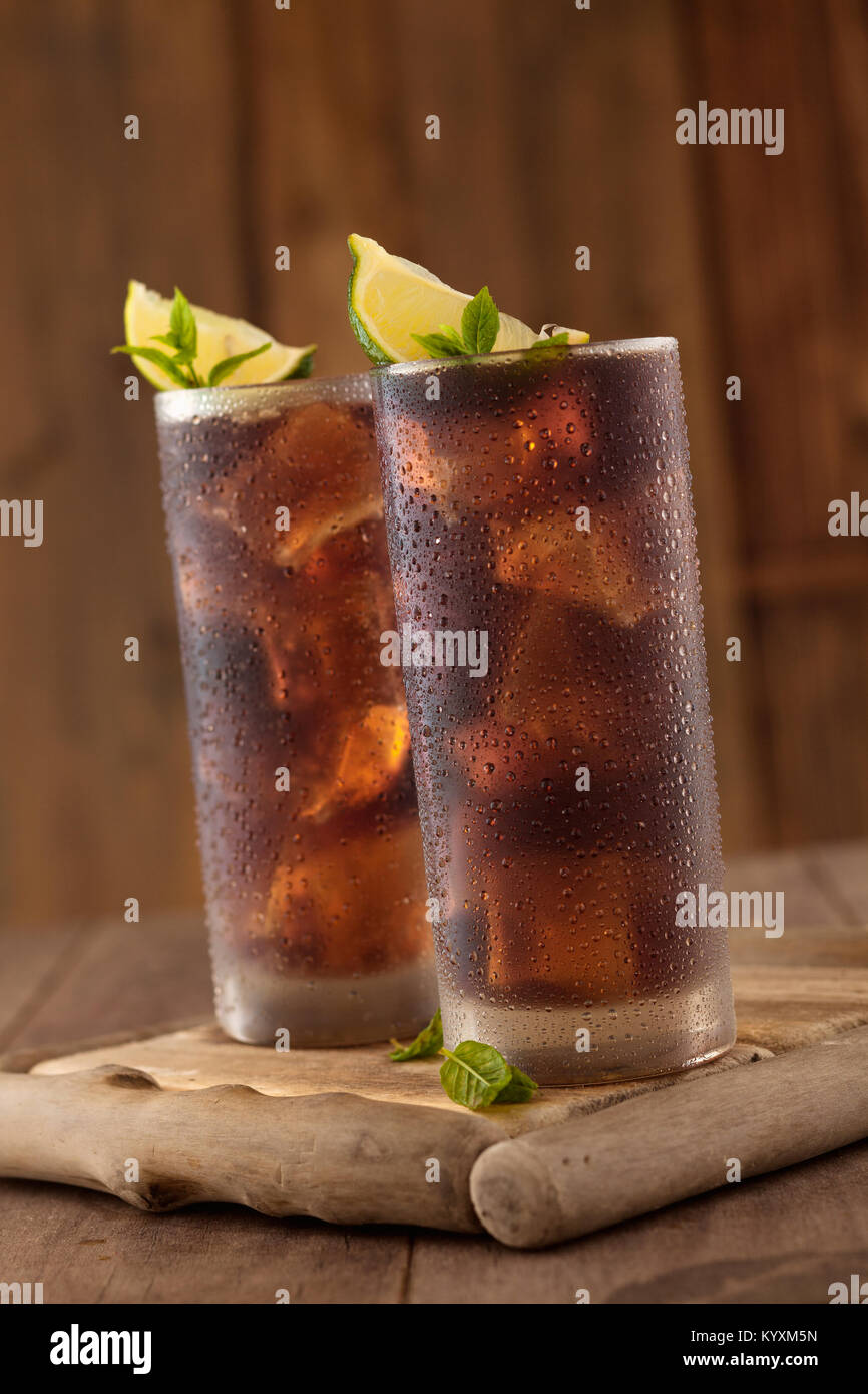 Cola glass with ice cubes and droplets Stock Photo - Alamy