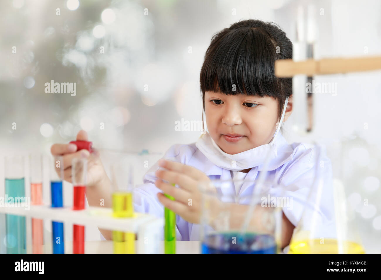 Asian girl doing laboratory test, science classroom Stock Photo - Alamy