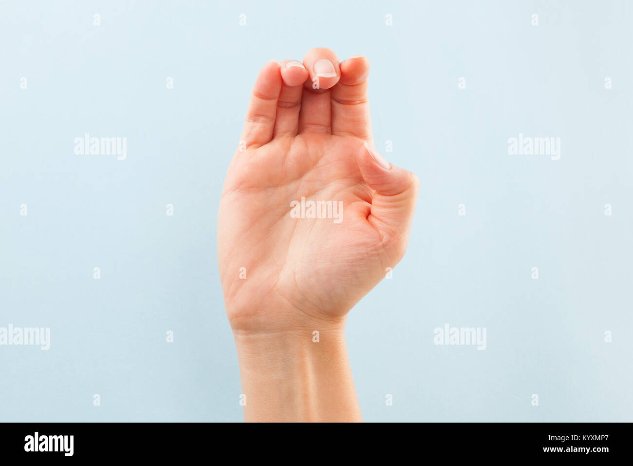 American sign language. Female hand showing letter C isolated on blue ...