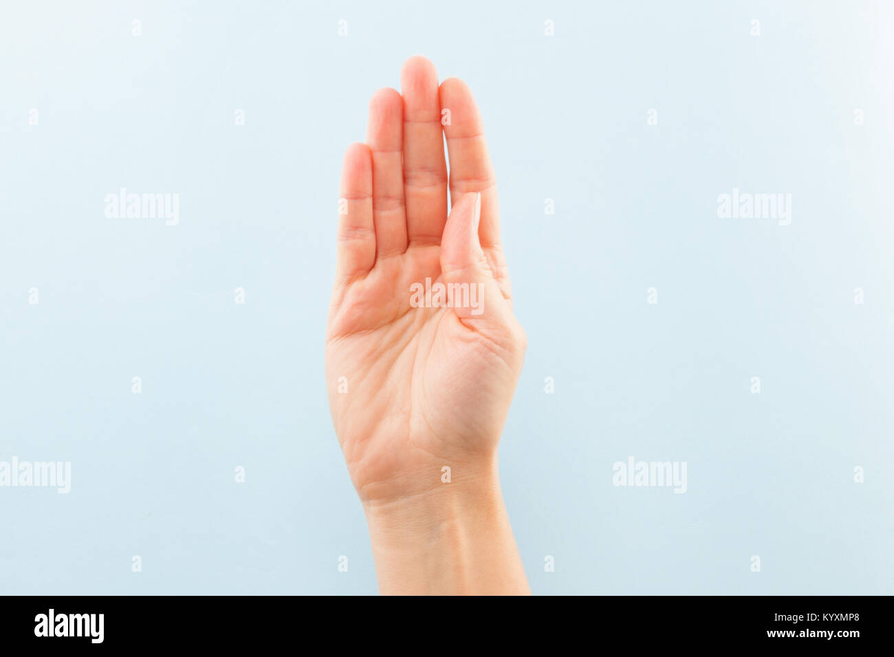 American sign language. Female hand showing letter B isolated on blue ...