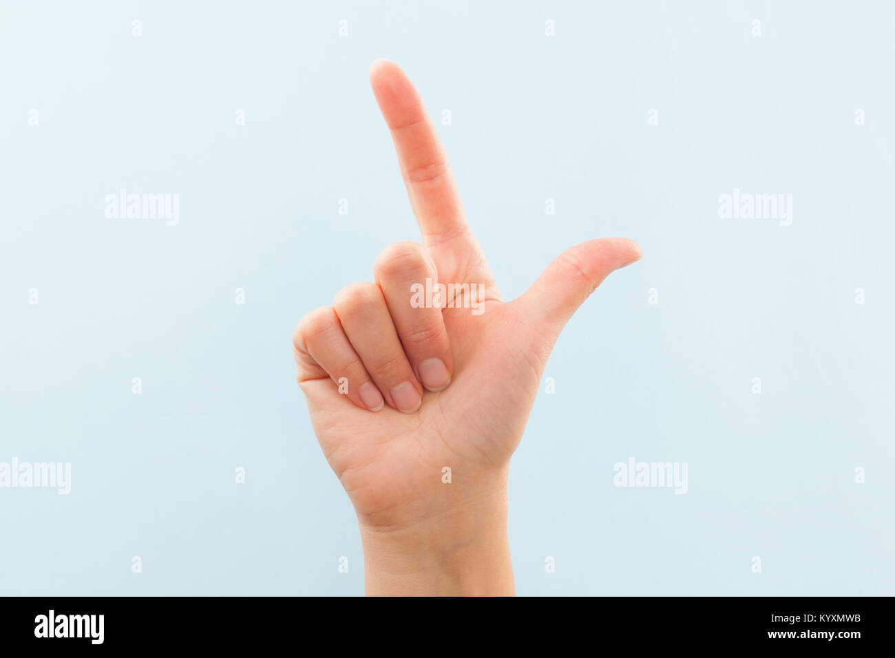 American sign language. Female hand showing letter L isolated on blue ...