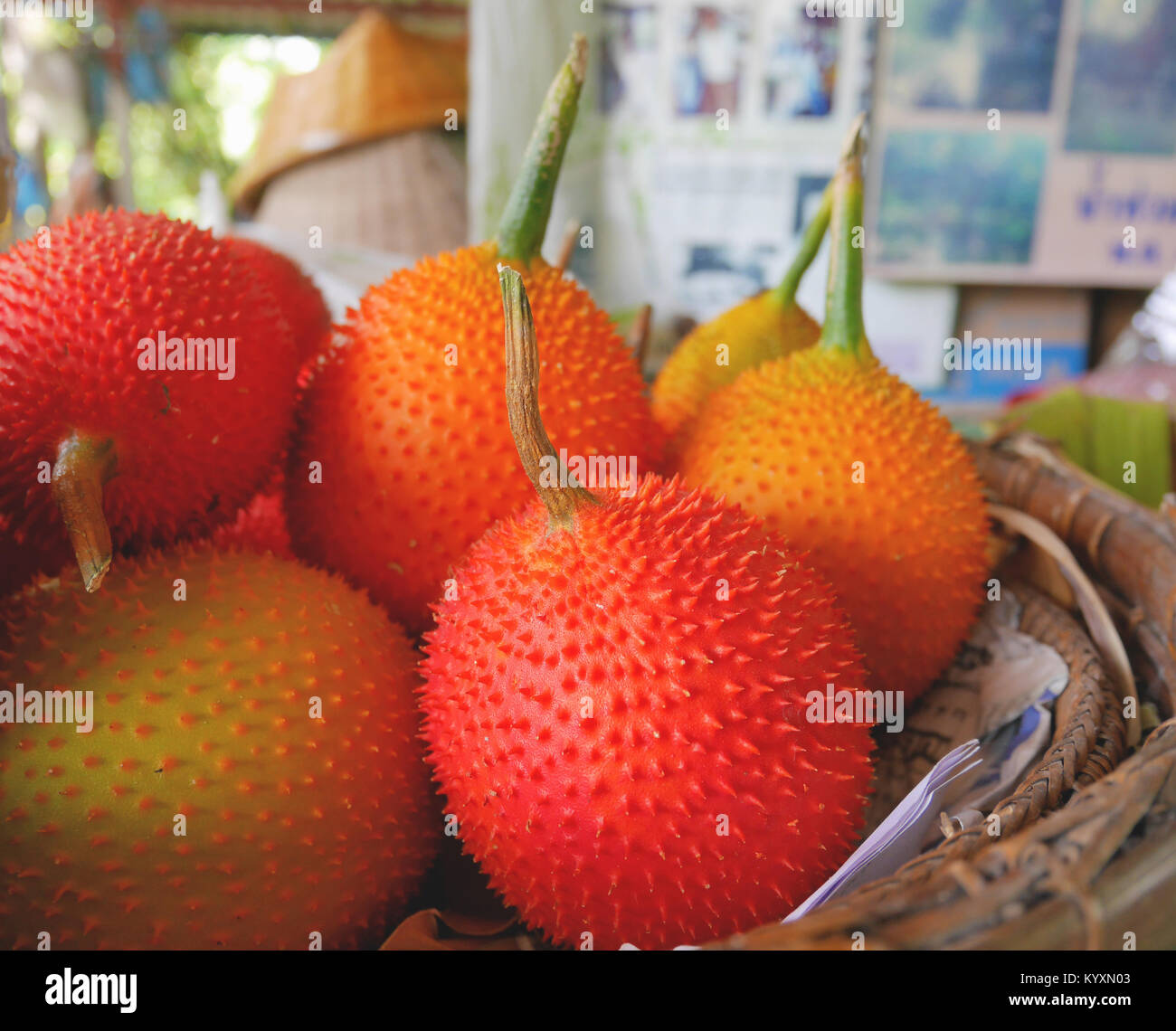 Pink, orange and green baby jackfruit in a basket Stock Photo - Alamy