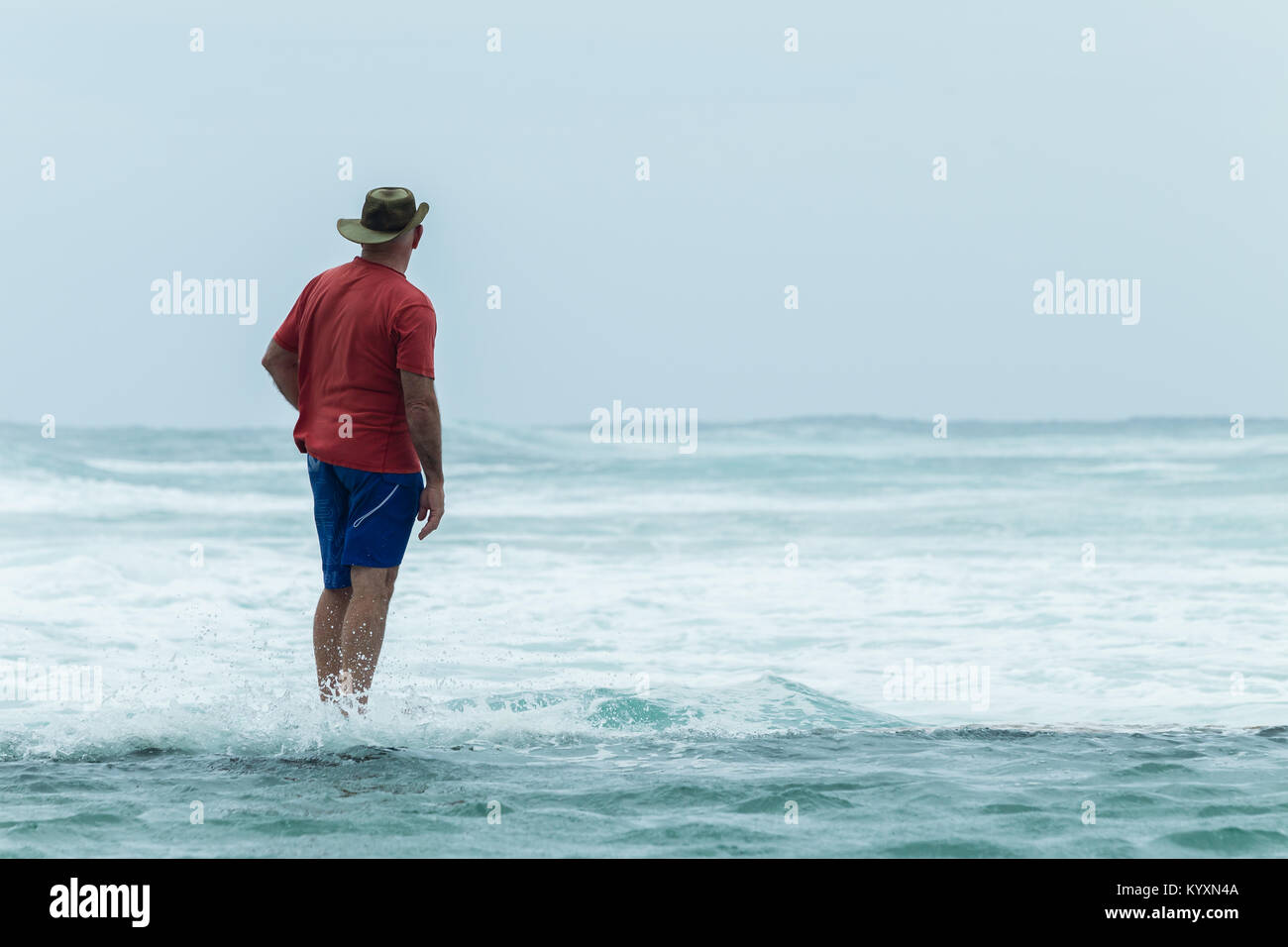 Man watching action of the waves hi-res stock photography and images ...