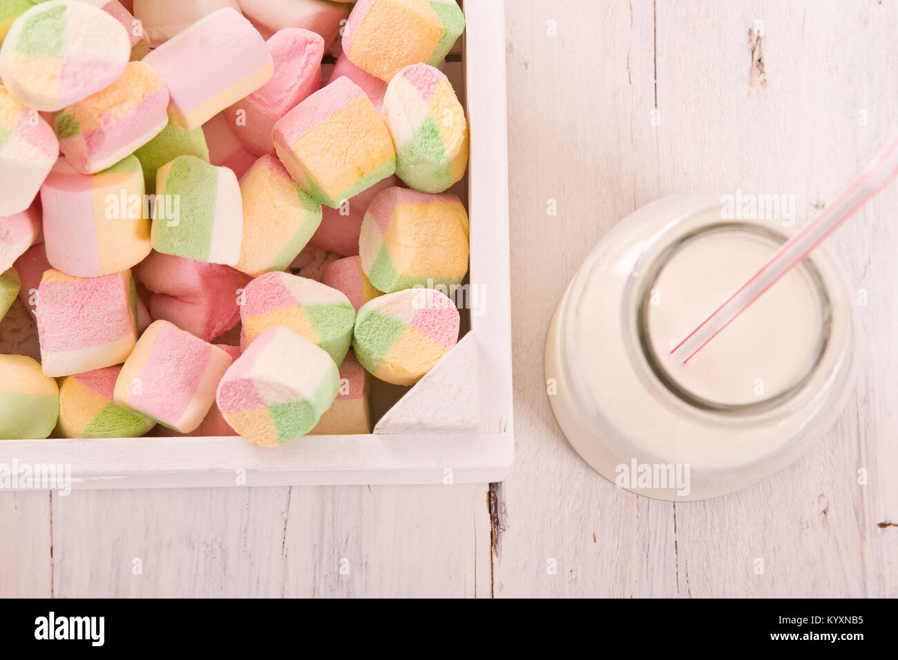 Marshmallows on wooden table Stock Photo - Alamy