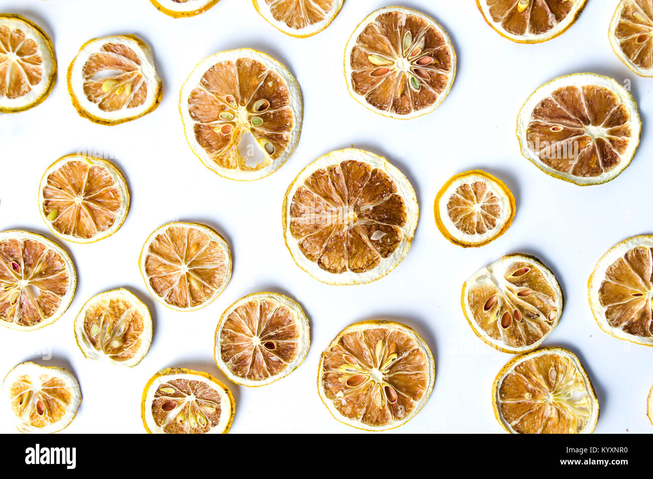 Dried sliced lemon background pattern isolated on white Stock Photo - Alamy