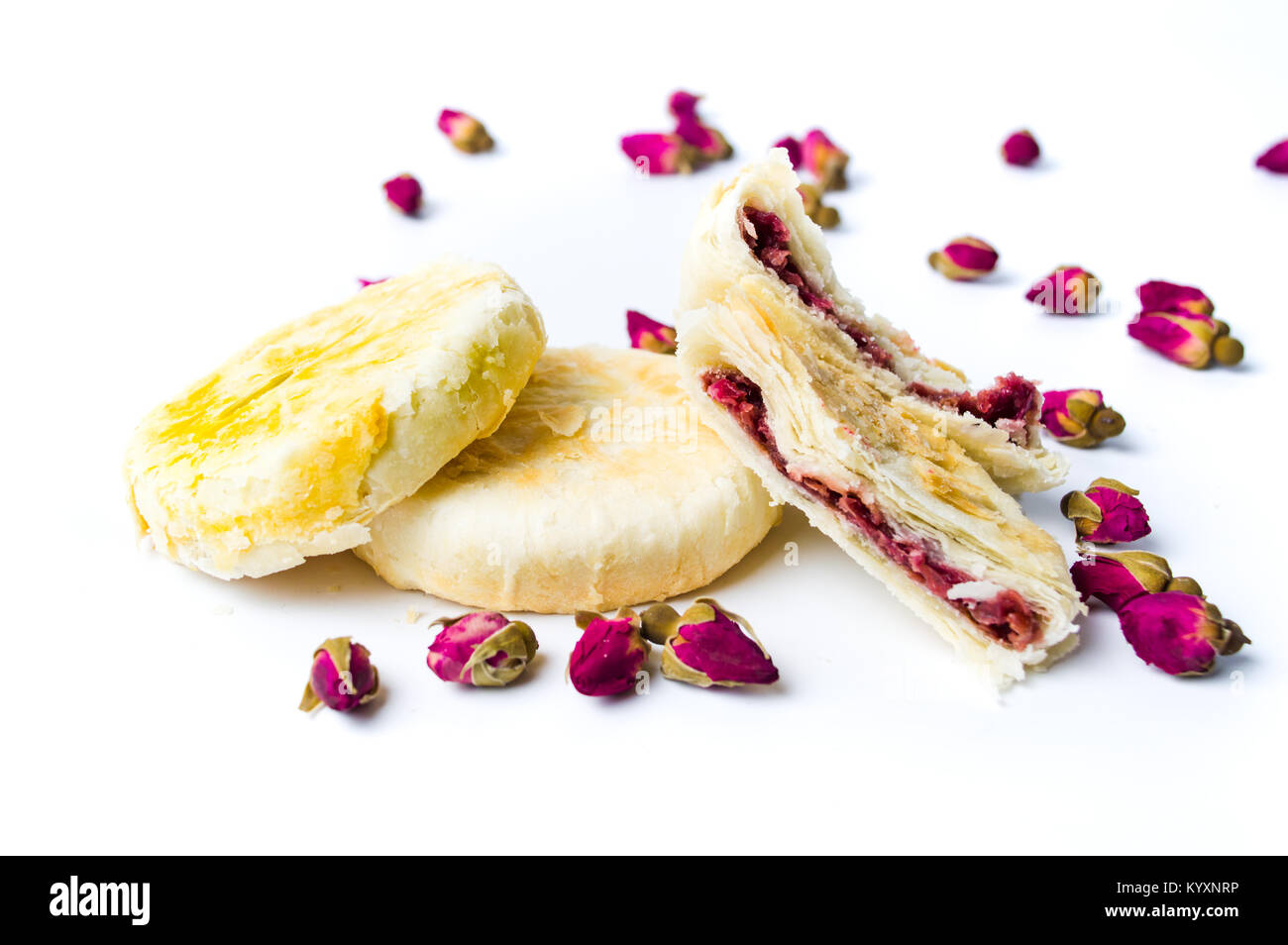 Rose pastry with natural flowers tea on white background Stock Photo ...