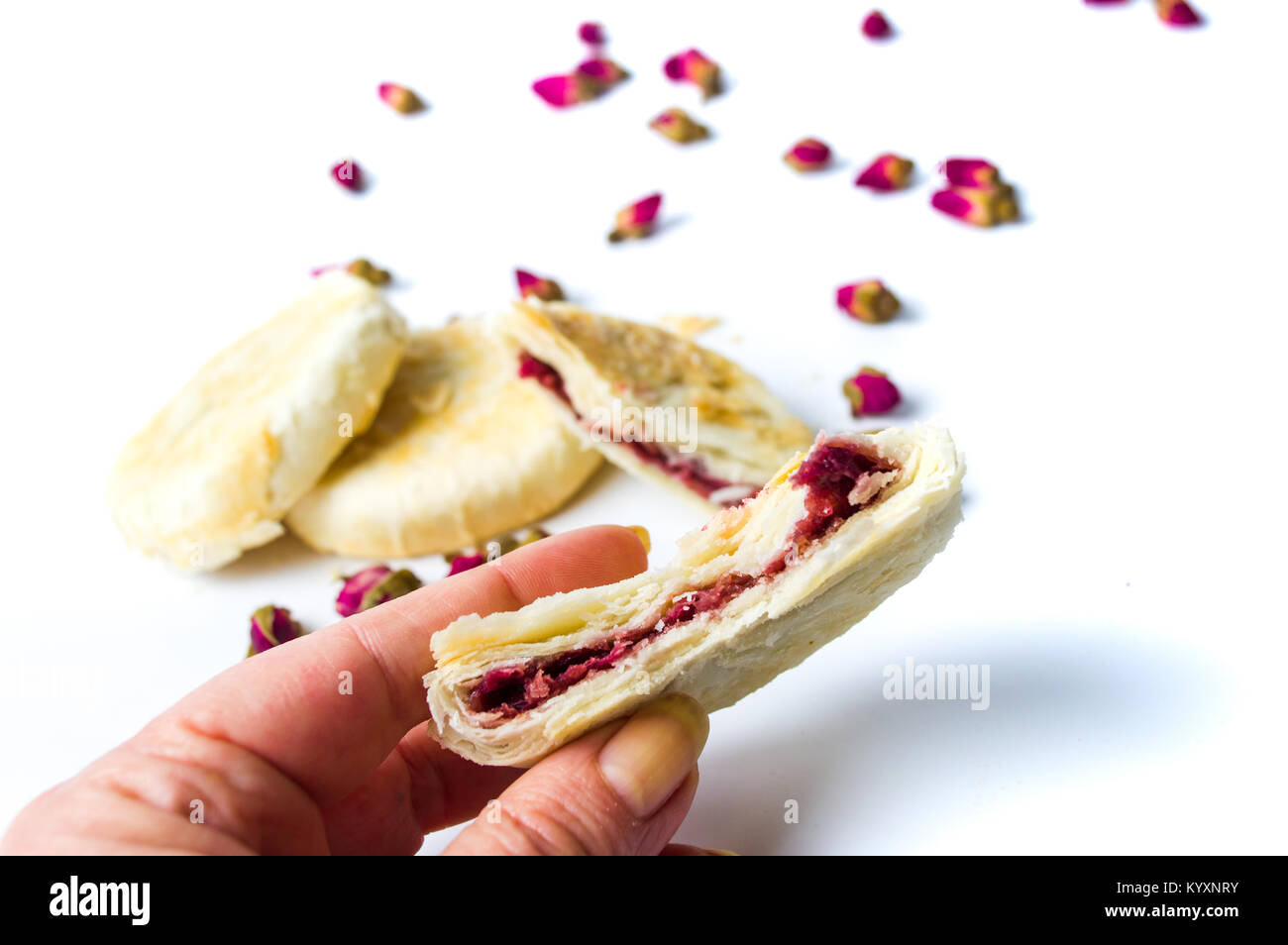 Rose pastry with natural flowers tea on white background Stock Photo ...