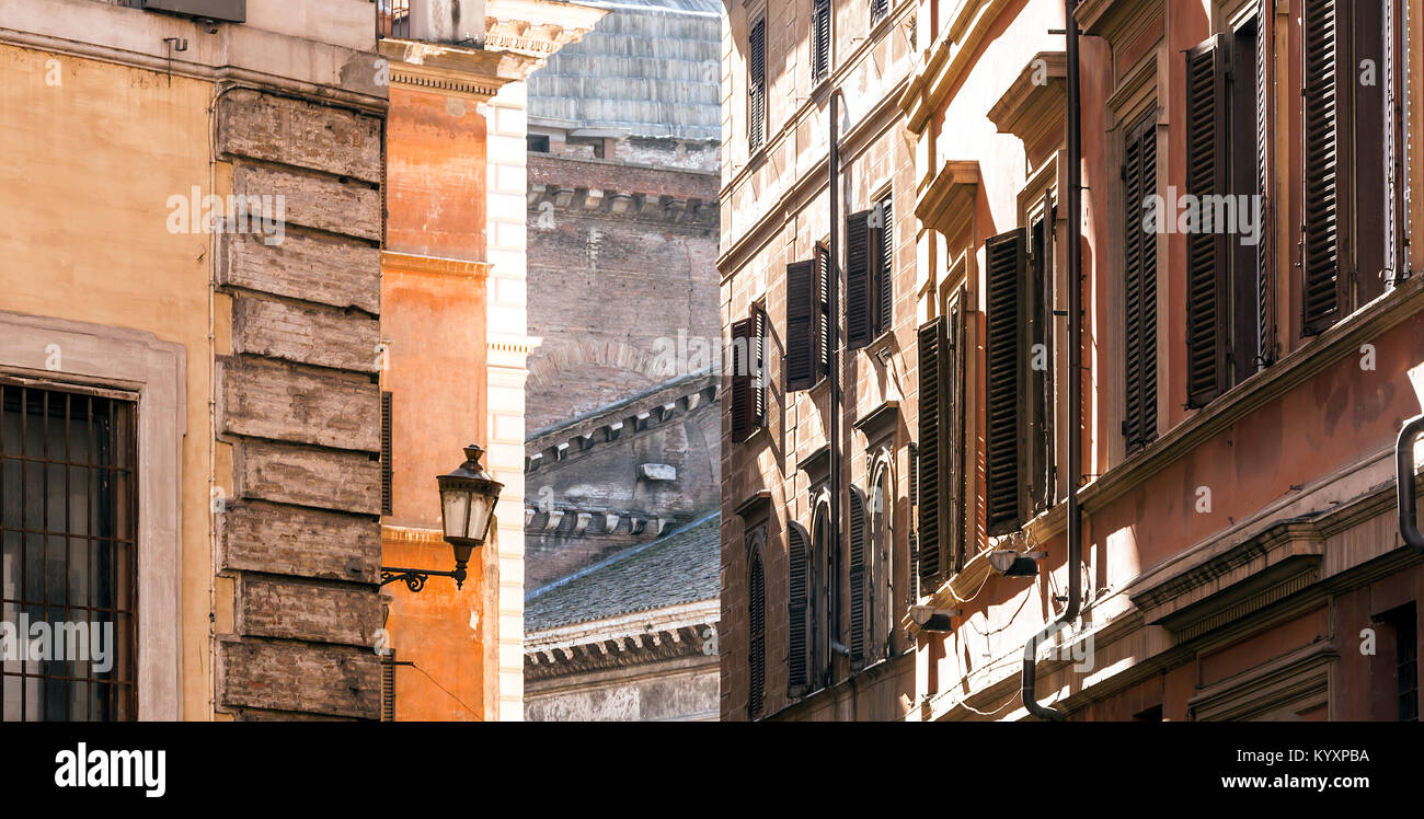 Old city lamp in a small alley with the Roman Pantheon in the distance ...