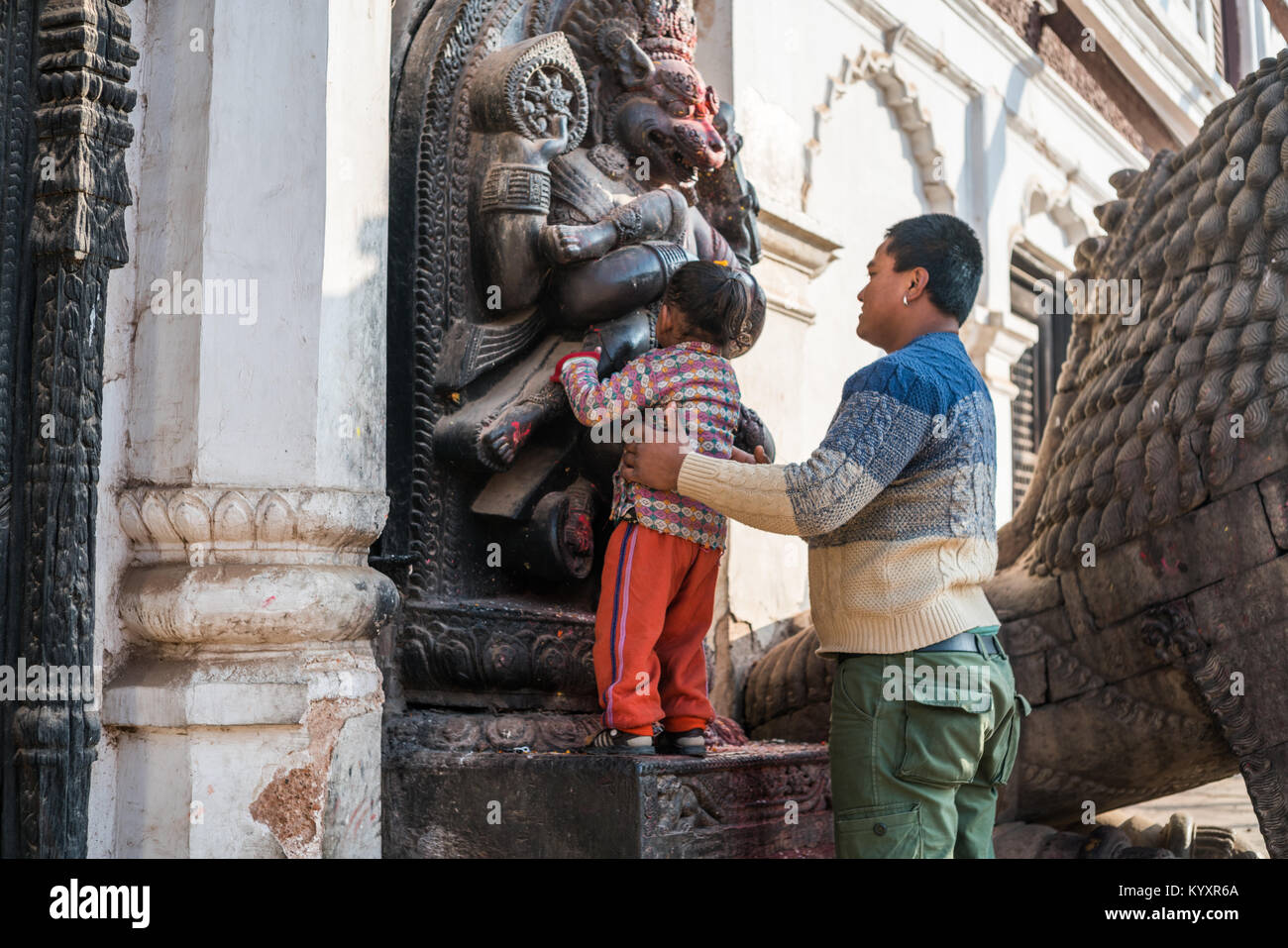 father teach his son in the Rameshwar Temple, Bhaktapur, Nepal, Asia ...
