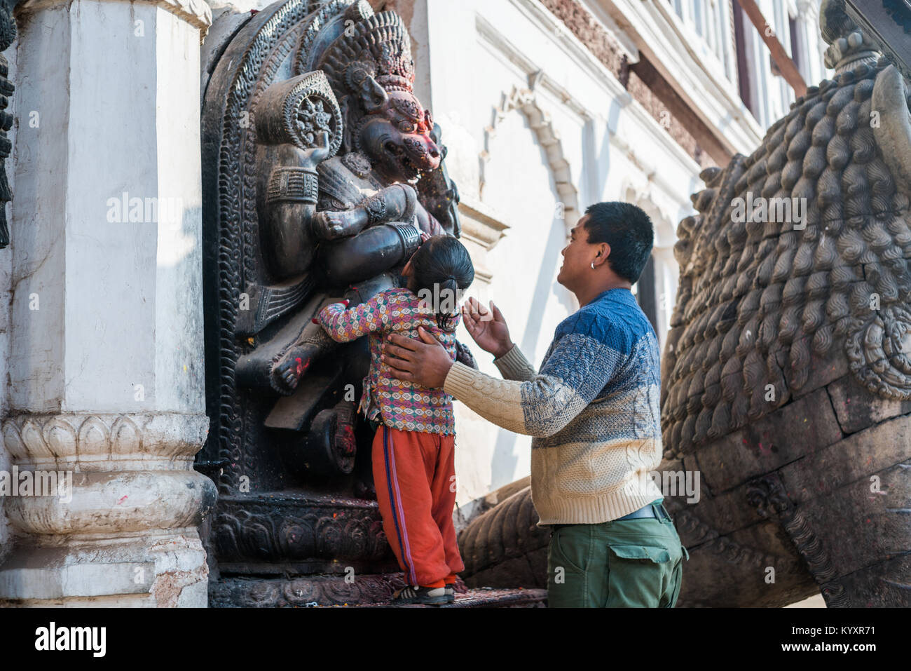 father teach his son in the Rameshwar Temple, Bhaktapur, Nepal, Asia ...