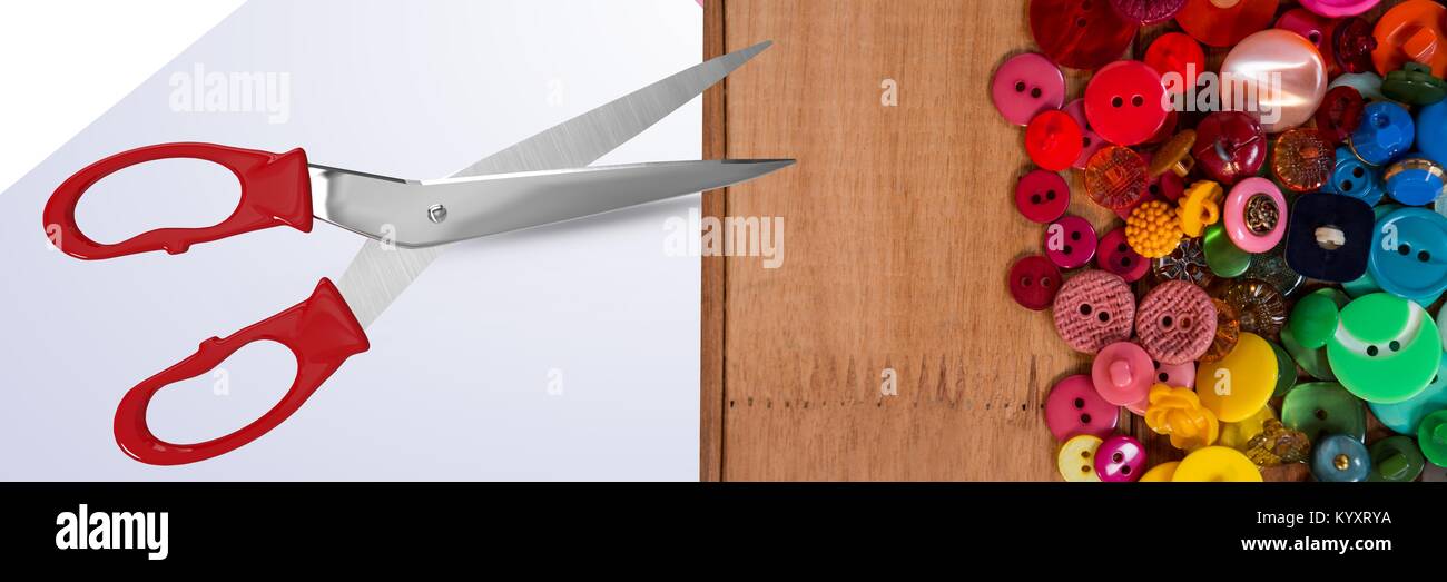 Scissors with buttons Stock Photo - Alamy