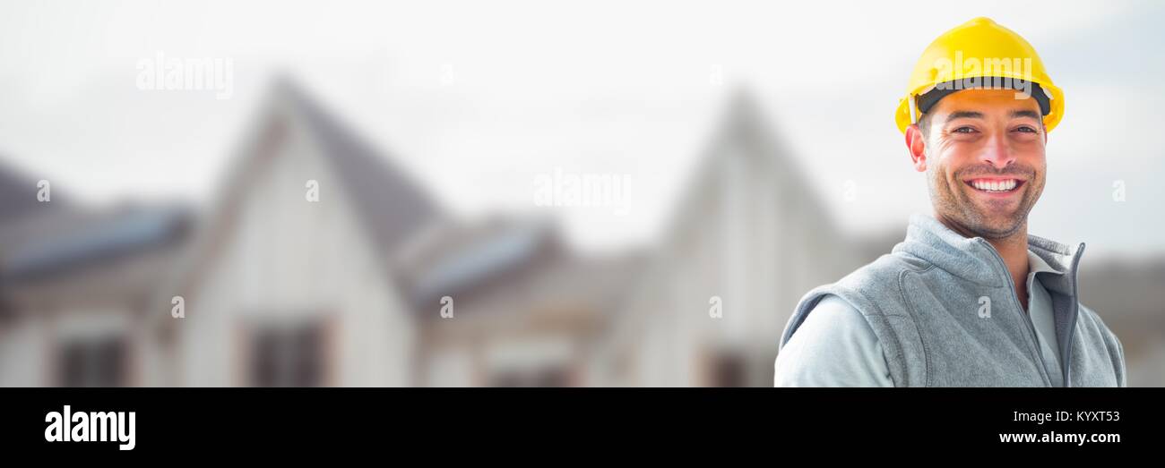 Construction Worker on building site wearing helmet Stock Photo - Alamy