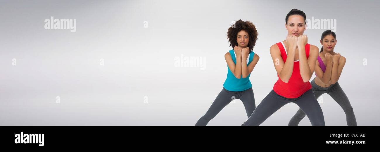 Fit athletic women with grey background doing exercise Stock Photo - Alamy