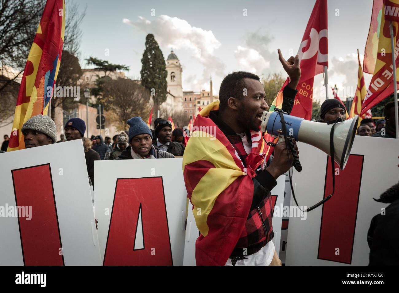 People march in a national demonstration for the rights of migrants ...