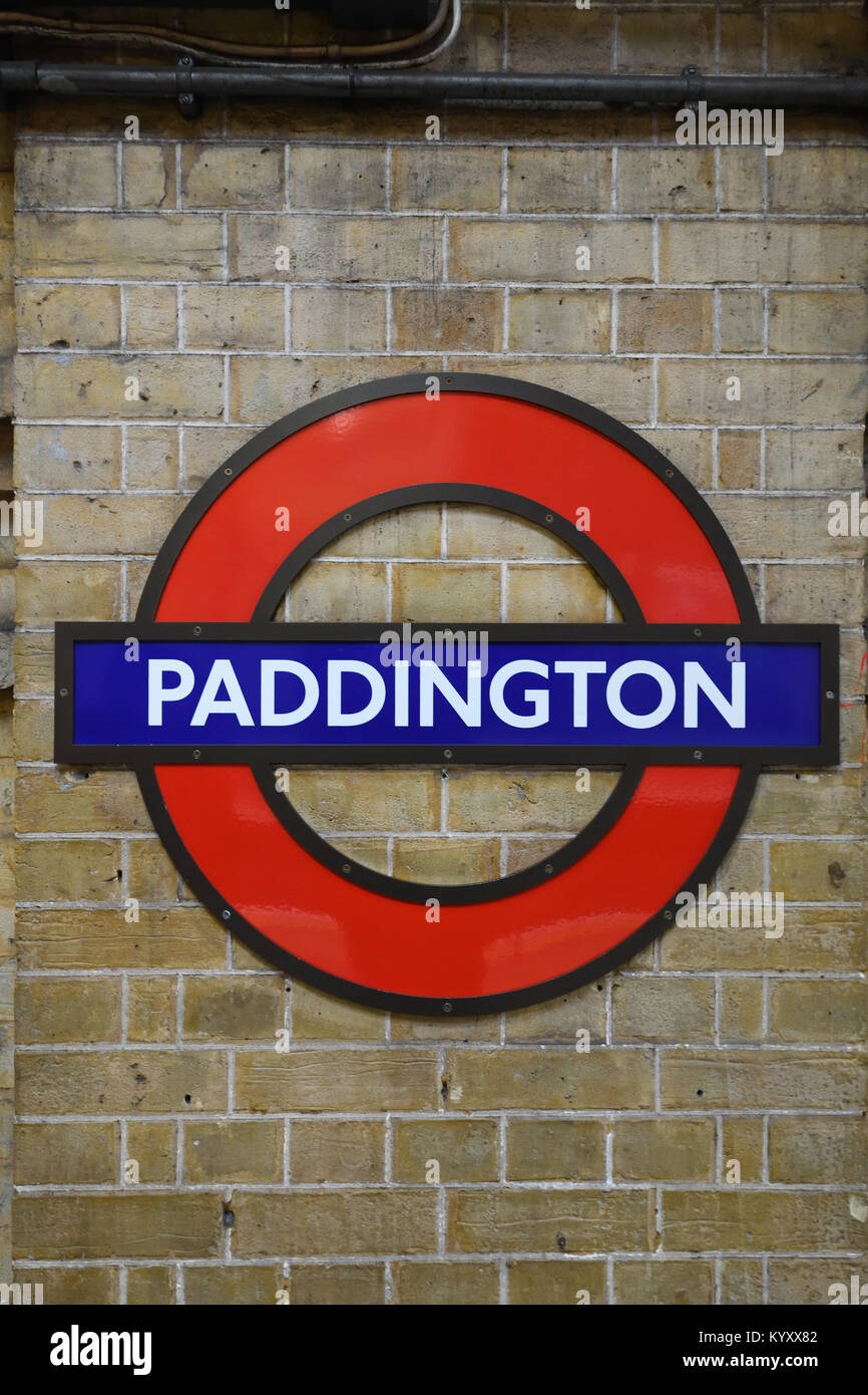 Paddington tube station sign against brick wall in London, January 2018 ...