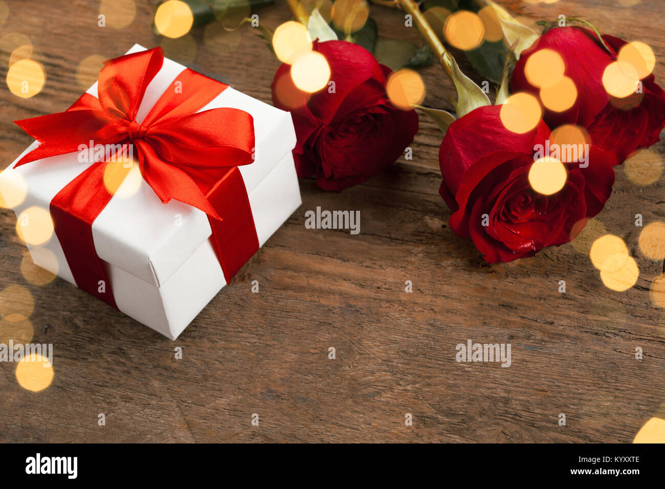 gift box with red roses Stock Photo - Alamy