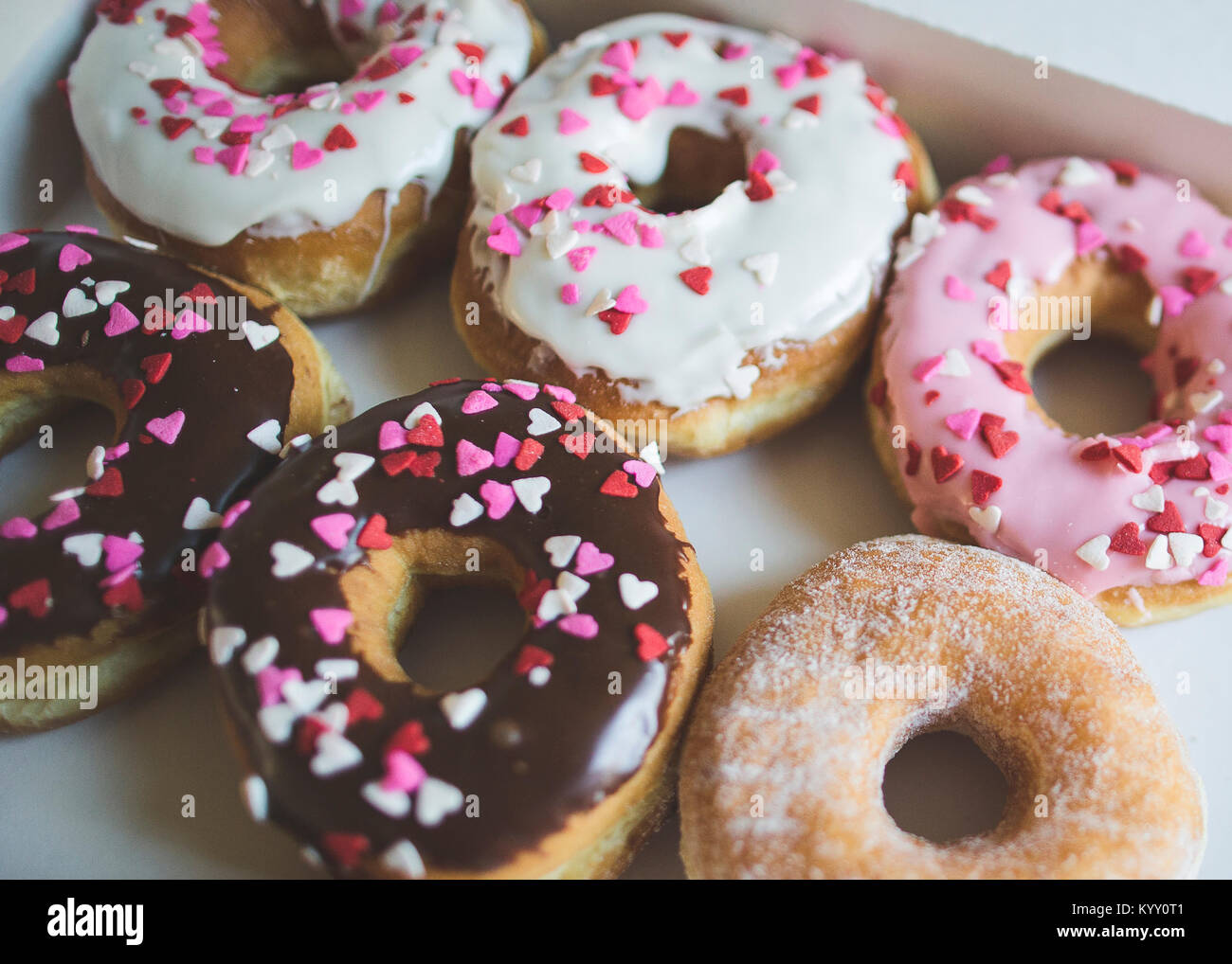 High angle view of donuts in box Stock Photo - Alamy