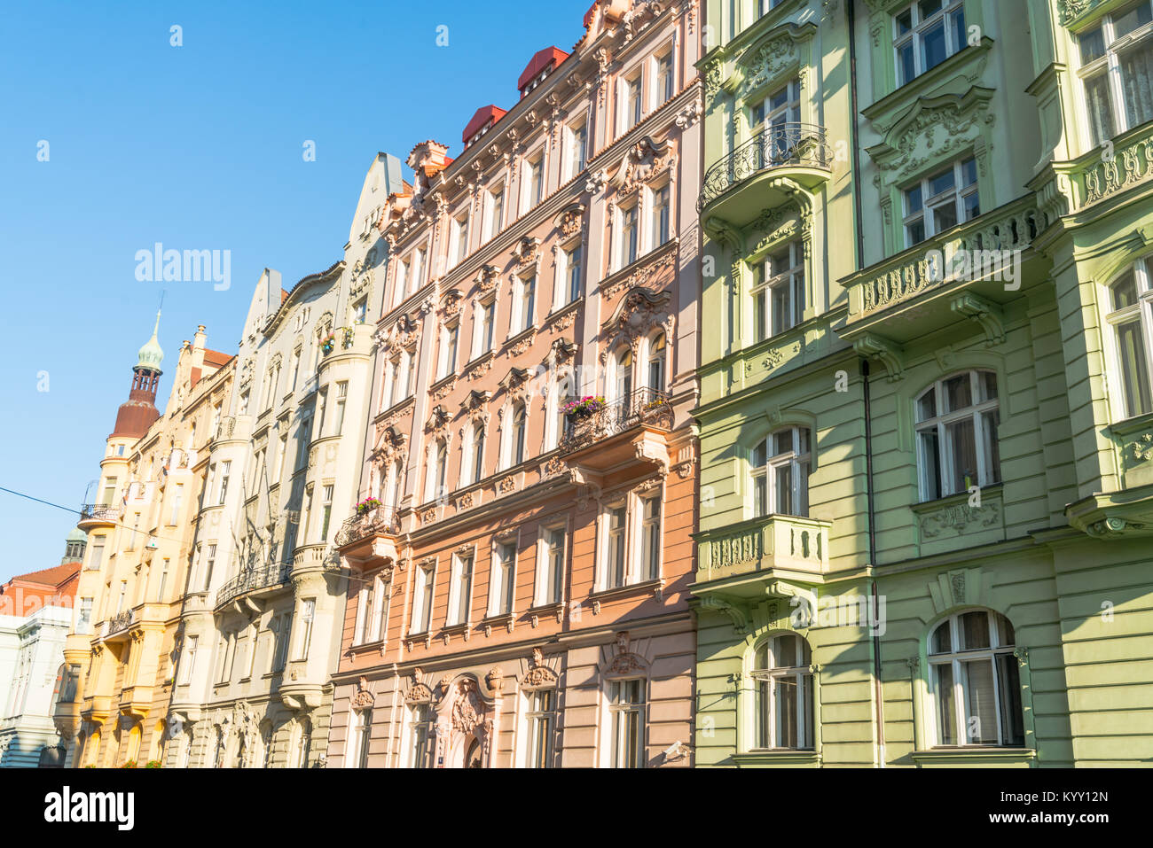 Street fronts of row houses of different colors and traditional ...