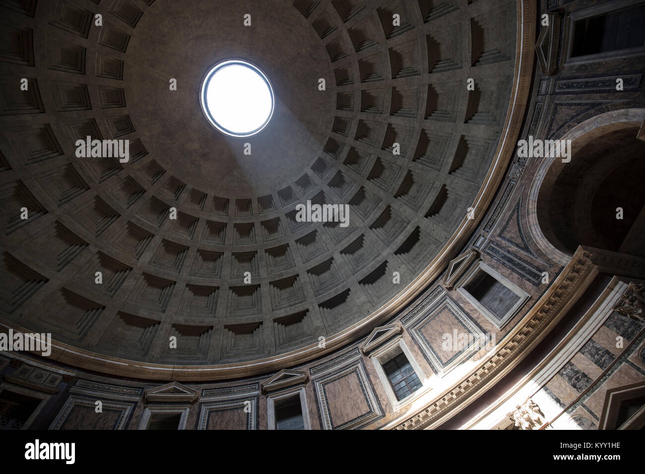 Low angle view of sunlight falling from hole at Pantheon Stock Photo ...