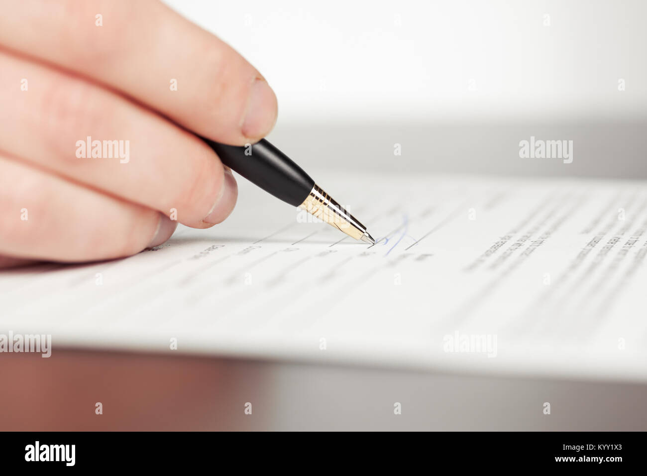 Business woman signing contract Stock Photo - Alamy