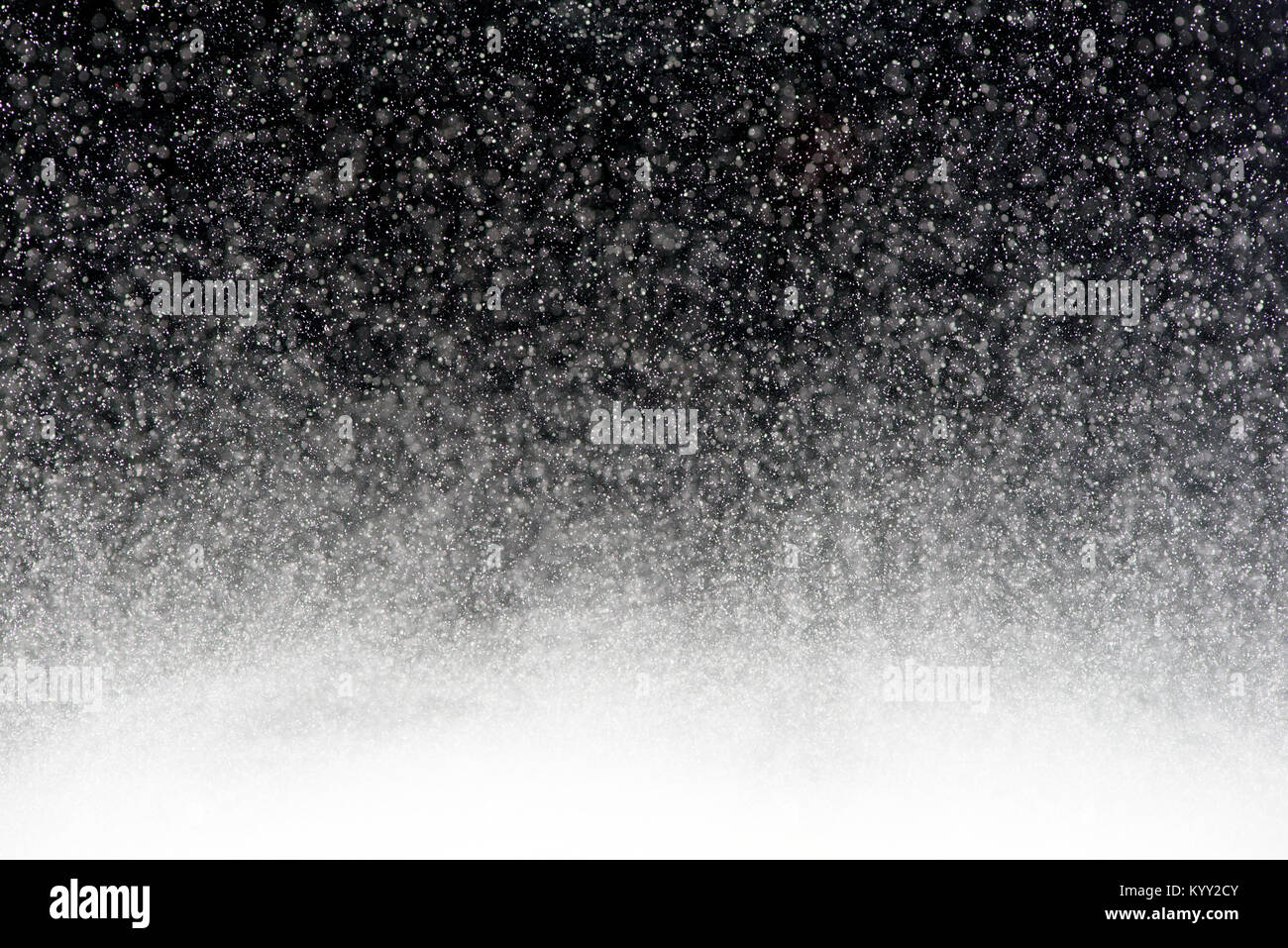 White snow like particles similar to a snowstorm creates a bokeh ...