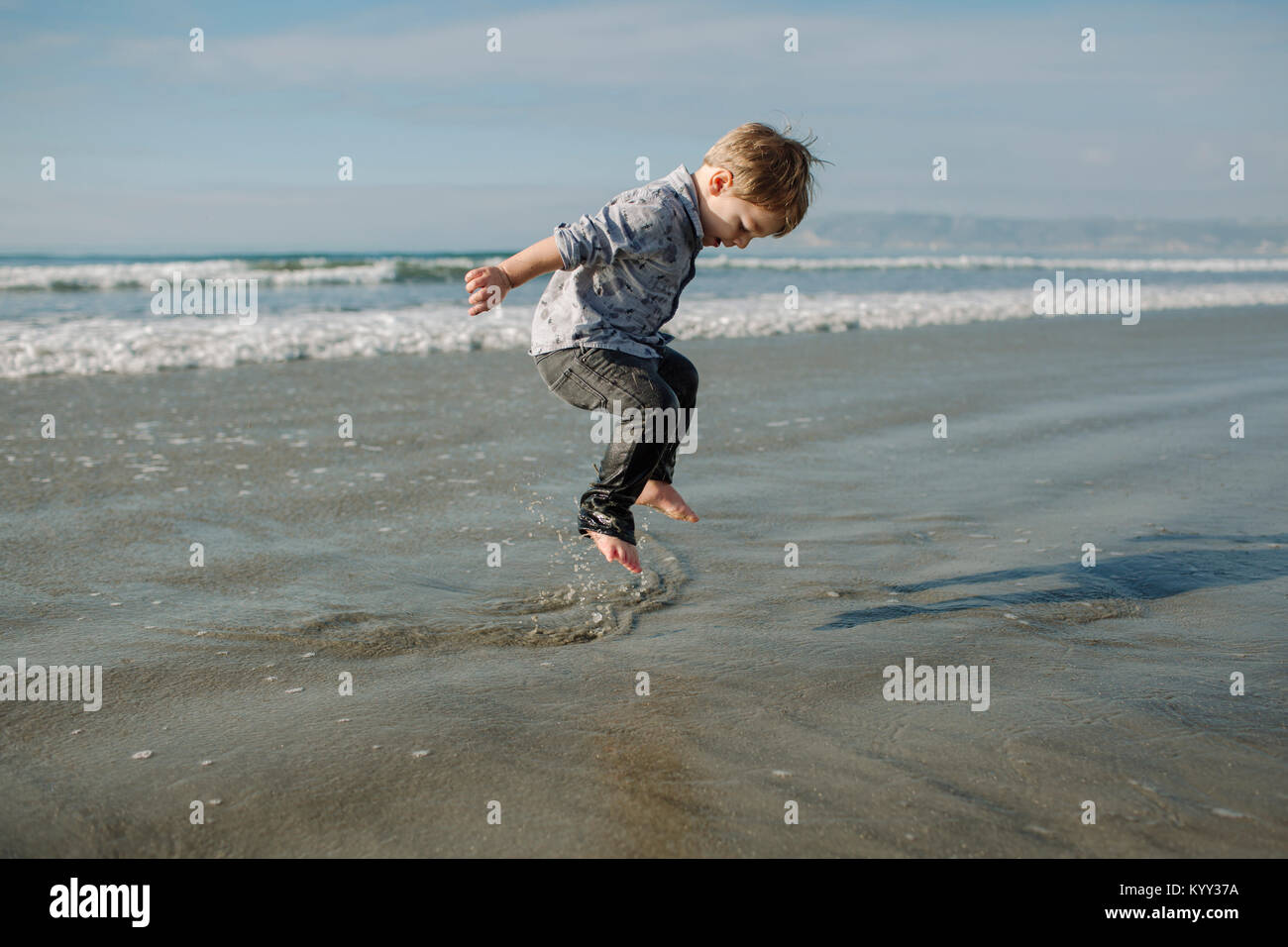 Boy jumping into water hi-res stock photography and images - Alamy