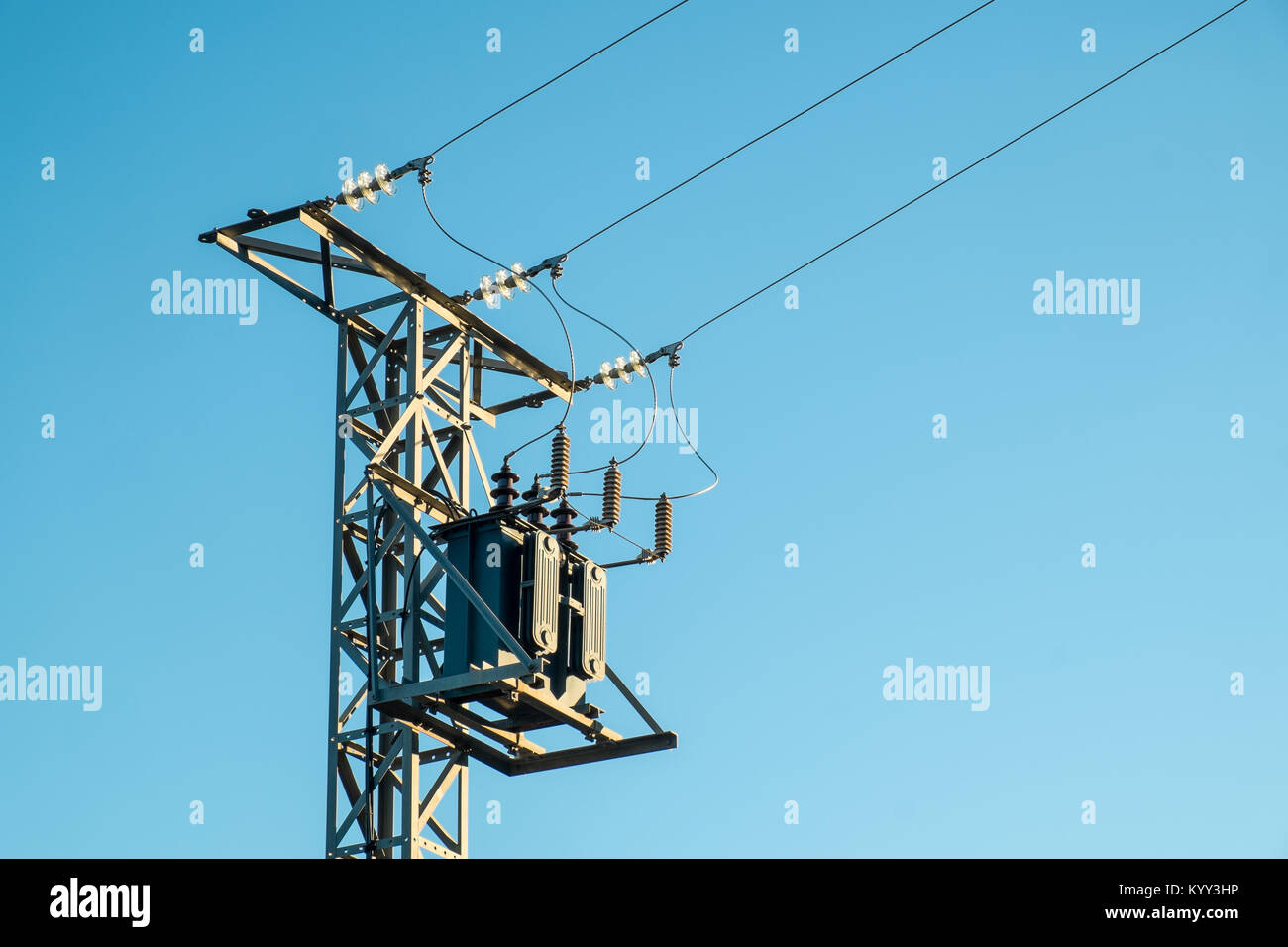 Large electricity pylon with a transformator unit Stock Photo - Alamy