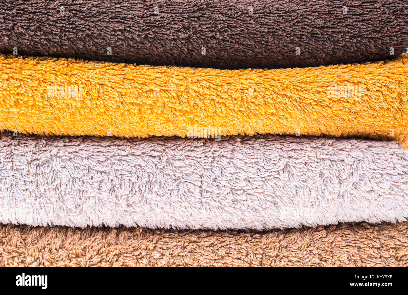Stack of terry towels on wooden table. Studio Photo Stock Photo - Alamy