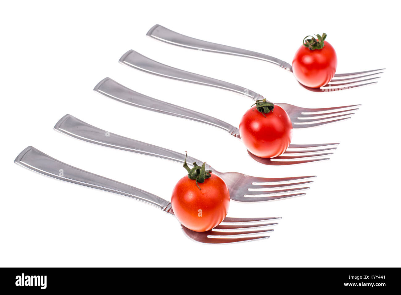 Concept of dietary healthy nutrition. Cherry tomatoes on forks. Studio ...
