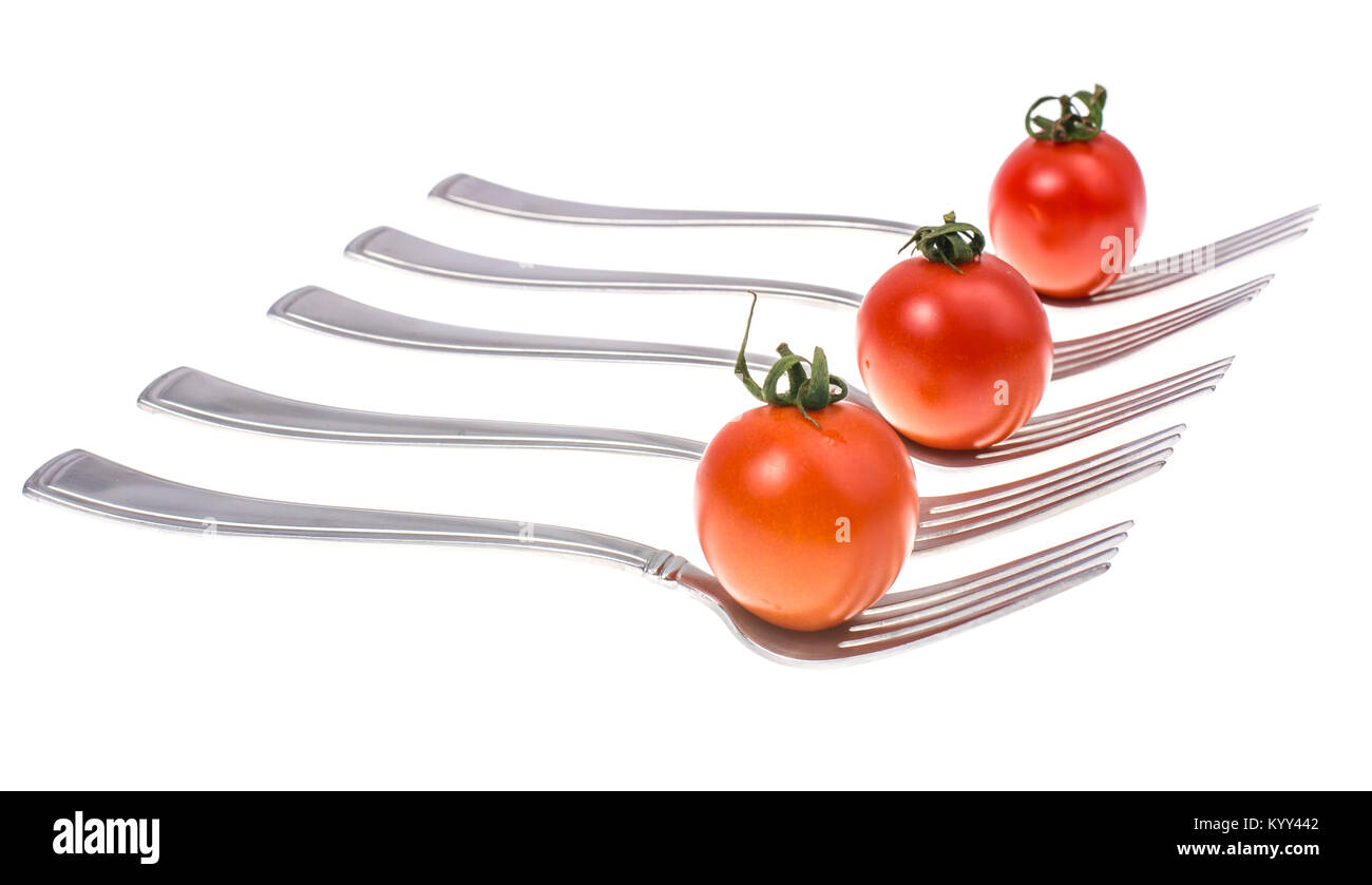Concept of dietary healthy nutrition. Cherry tomatoes on forks. Studio ...