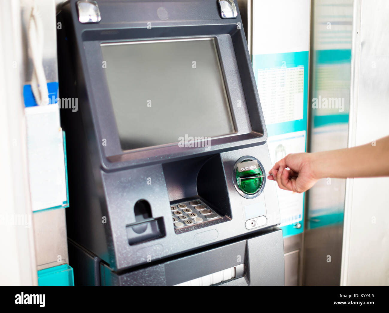 Man using atm machine with his credit card Stock Photo - Alamy