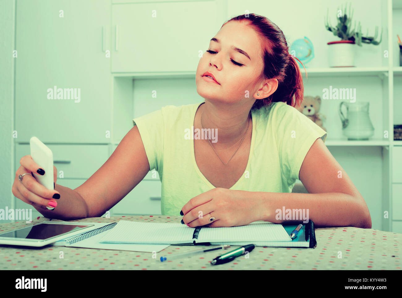 Young happy spanish girl school pupil taking self portrait on ...