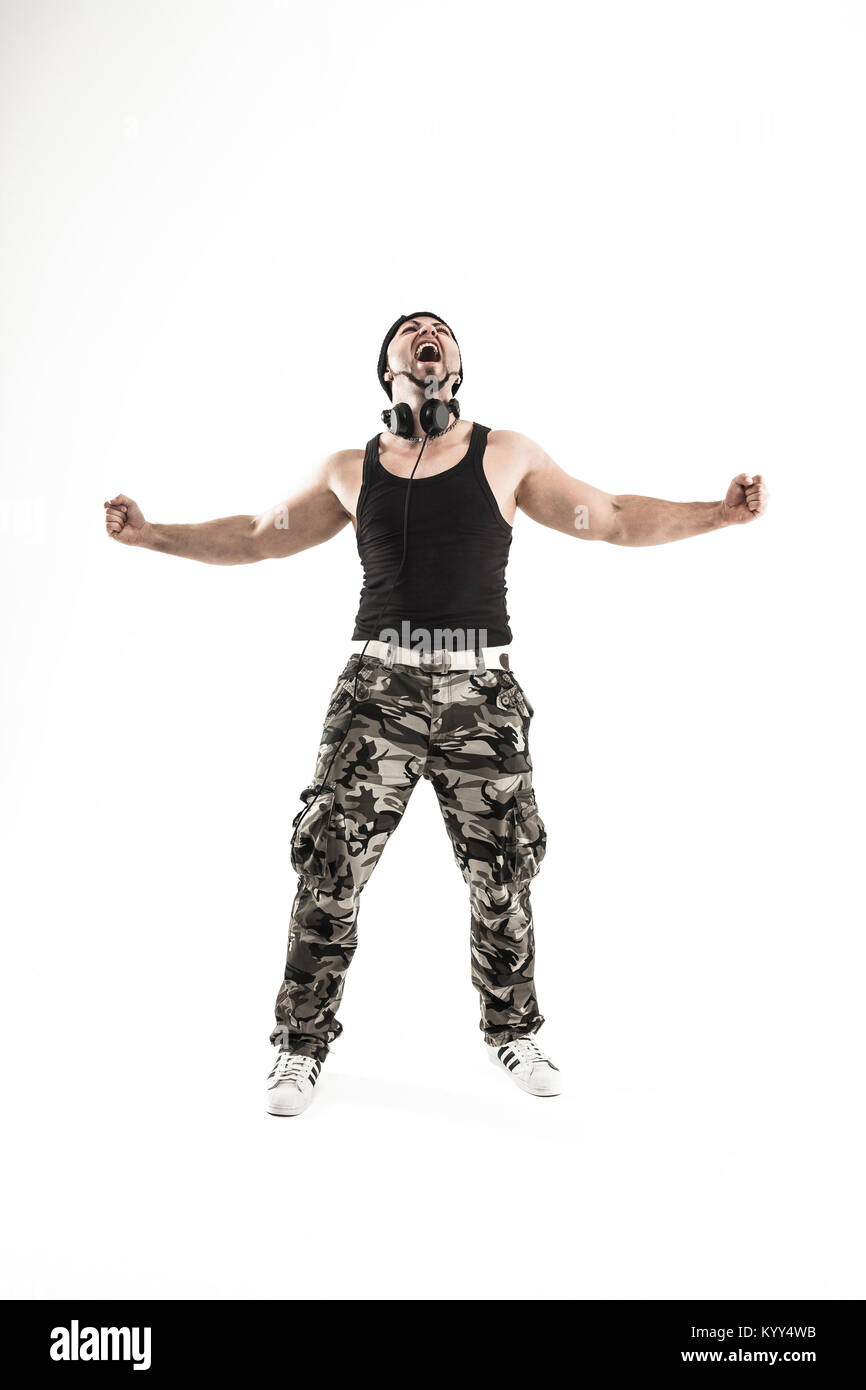 emotional and charismatic DJ - rapper with headphones on a light Stock ...