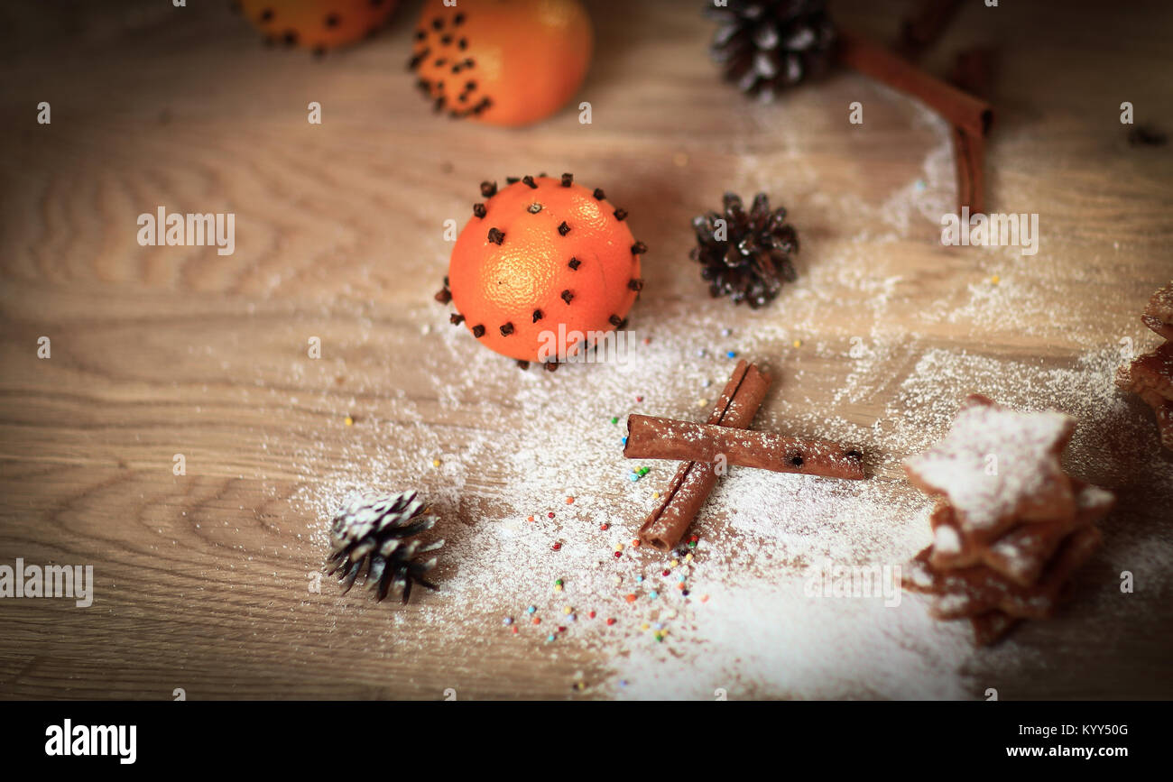 Christmas table. background image of cinnamon sticks,oranges an Stock ...