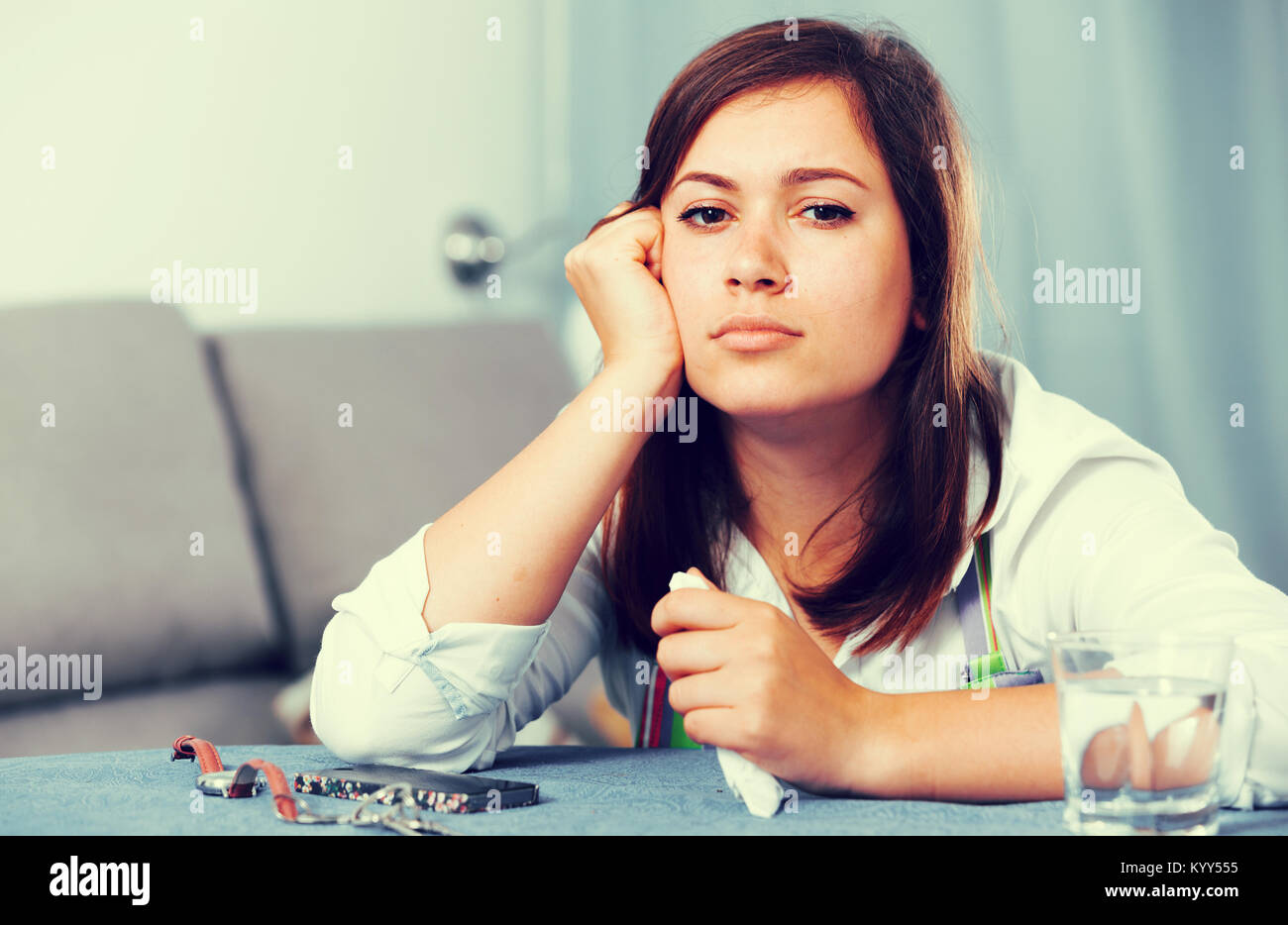Young woman feeling distressed and lonely alone at home Stock Photo - Alamy